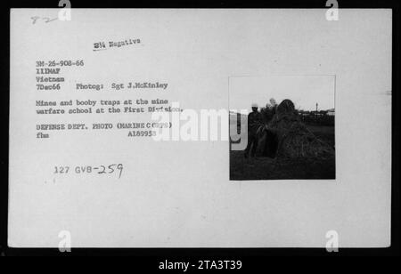 Soldiers at the Mine Warfare School are seen examining a display of ...