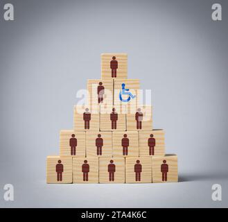 Inclusive workplace culture. Pyramid of wooden cubes with human icons ...
