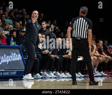 Utah head coach Craig Smith claps after a play against Oregon State ...