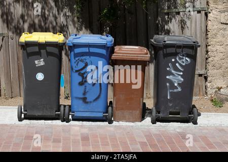 Colorful various recycling garbage cans and garbage cans, standing on ...