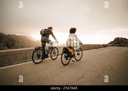 Two Female Friends Riding On Skateboards In Urban Skate Park Stock ...