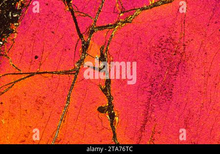 Olivine crystal in a basalt thin section. Olivine is a magnesium iron ...