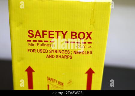 Sign for Biohazard medical waste. Arabic writing can read Biohazard ...
