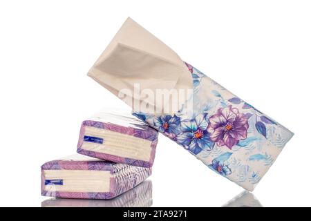 Three packs of paper handkerchiefs, close-up, isolated on white ...