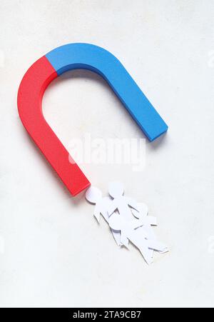 Magnet attracting group of employees on white background. Recruitment ...