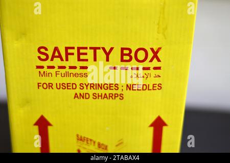 Sign for Biohazard medical waste. Arabic writing can read Biohazard ...