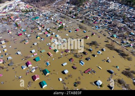 A large area with country houses flooded with water during the spring ...