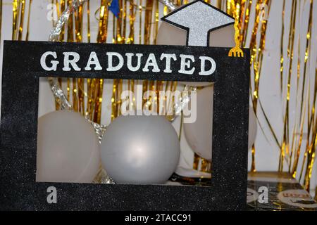 A frame with the word graduated for a graduation party, University ...