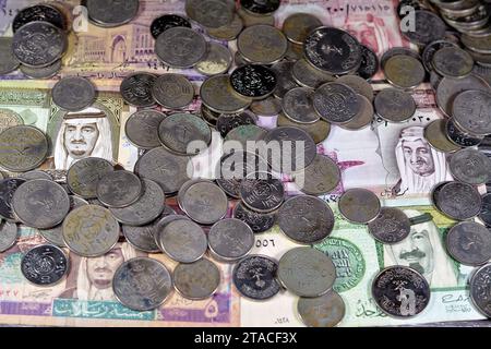 Saudi Arabia riyals money banknote bills and coins of different eras ...