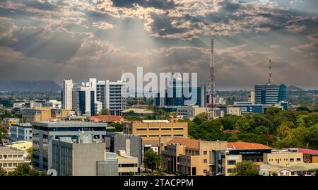 aerial view of Gaborone skyline, cityscape over green area and main ...