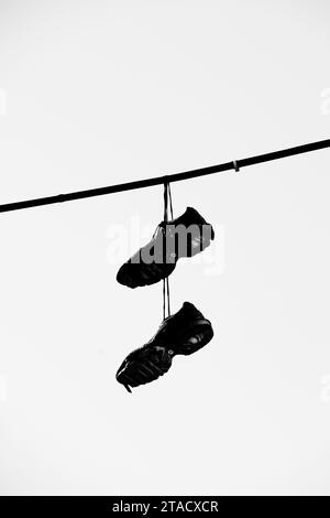 Shoes Hanging from Wire Stock Photo - Alamy