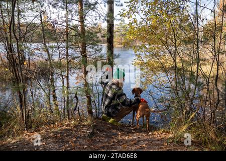 Woman hug her dog at park Stock Photo - Alamy