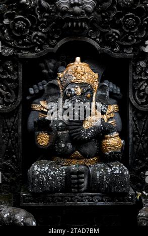 carving of a Hindu deity in a niche of a temple in Kathmandu, Nepal ...