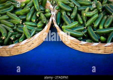 Fresh green bunch of cucumbers for sale in local market Stock Photo - Alamy