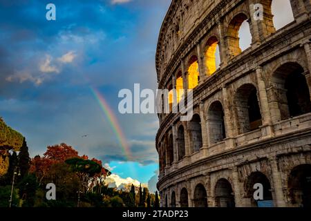 The colosseum with rainbow by its left side, Rome, the capital city of ...