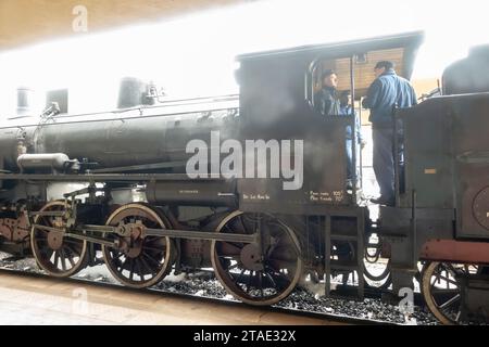 Old Italian restored steam locomotive,park on the platform. Siena ...
