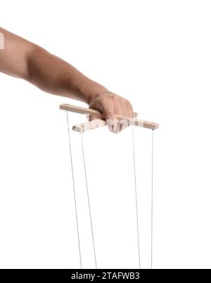 Man holding puppet control bar with strings on white background ...