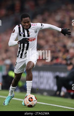 Liverpool, UK. 30th Nov, 2023. Tobias Lawal of LASK trying to keep warm ...