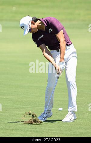 Min Woo Lee of Australia plays a shot in round one of the Australian ...