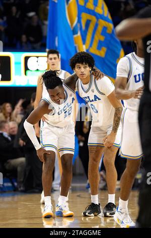 UCLA guard Sebastian Mack, left, shoots the ball past CS Dominguez ...