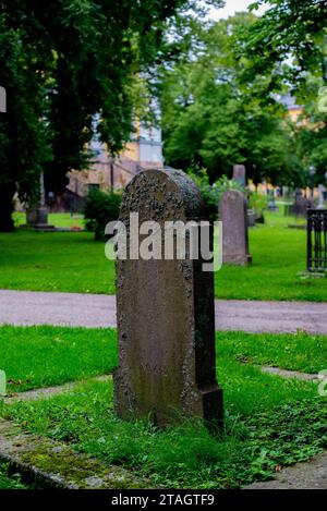 An outdoor cemetery with a lush, green landscape Stock Photo - Alamy