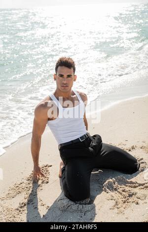 Good looking and muscular young cuban man in black and stylish outfit ...