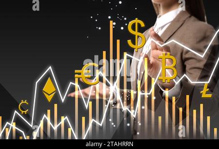 Businesswoman using virtual screen with graphs on dark background Stock ...