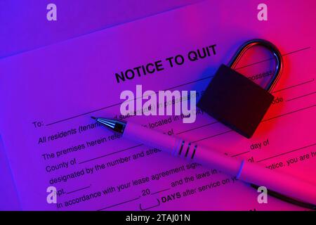 Notice to quit blank form with pen and small padlock on office table ...