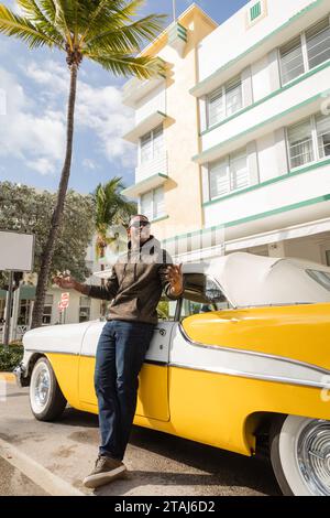 Miami, USA - December 7, 2022. Yellow taxi crossing in front of the ...