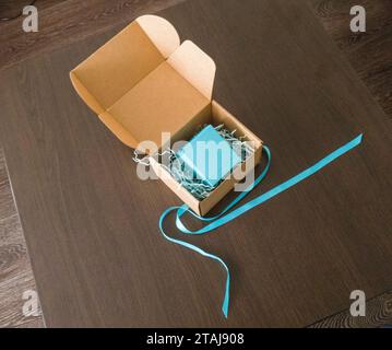 Close up of unwrapped gift box Stock Photo - Alamy