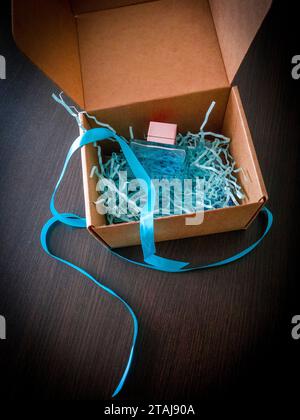 Close up of unwrapped gift box Stock Photo - Alamy