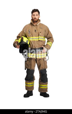 Serious bearded firefighter in uniform holding protective helmet in ...