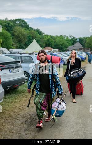 The people during the annual Ozora Festival near the Hungarian village ...