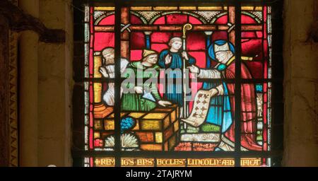 Stained glass window of bishop Remigius, founder, in the medieval ...