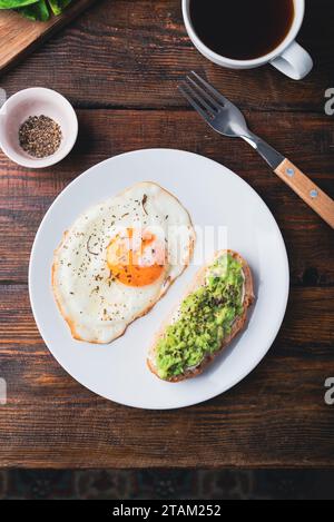 Avocado toast. Sandwich with egg, mashed on wholegrained bread. Healthy ...