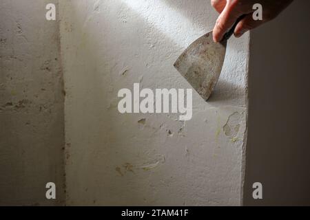 Surface Ready: Gloved Hand Scraping Wall with Painter's Spatula Stock ...