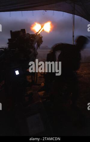 U.S. Marine Corps Cpl. Freeman Diah fires an M777 Howitzer during ...