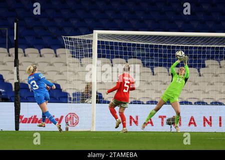 Wales goalkeeper Olivia Clark makes a save on a shot by England's Jess ...
