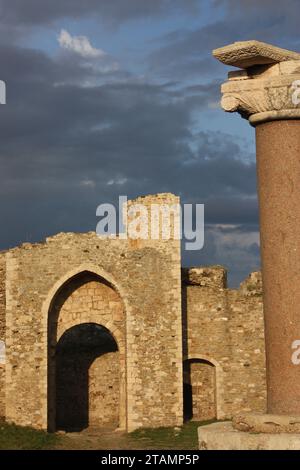 Column and arch in the interior of Methoni Castle, Greece Stock Photo ...