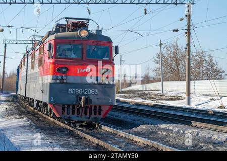 SHARYA, RUSSIA - MARCH 18, 2022: VL-80S electric locomotive with a ...