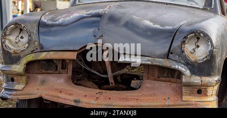 Front end of black 1950 Ford Custom Deluxe with chrome trim automobile ...