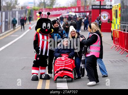 Fans arrive at The Gtech Community Stadium prior to the Premier League ...