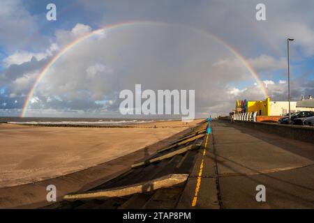 Rainbow over the beach and promenade at Prestatyn, North Wales Stock ...