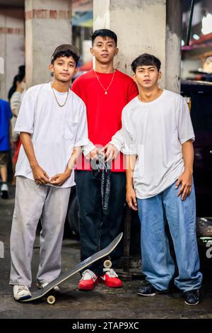 Three young teenage boys strike a pose in Manila, The Philippines Stock Photo - Alamy