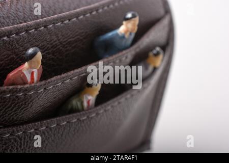 Tiny figurine of group of men miniature model in pockets Stock Photo ...