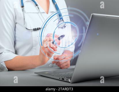 Doctor works with digital interface Stock Photo - Alamy