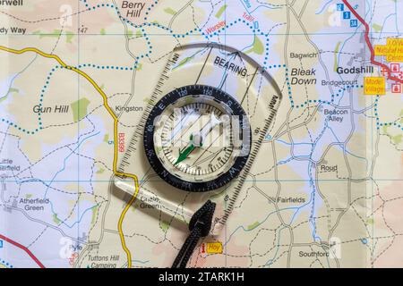 A map and compass, England, UK. Concept: navigation, finding your way ...