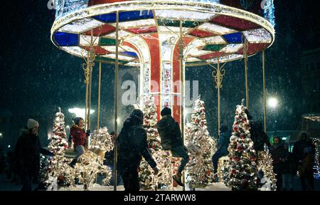 Christmas carousel with kids having fun Stock Photo - Alamy