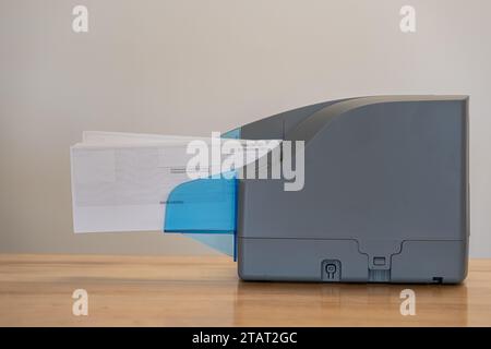 Bank Cheque scanner used to deposit cheques remotely Stock Photo - Alamy