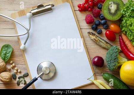 Empty notebook with vegetables on a wooden background Stock Photo - Alamy